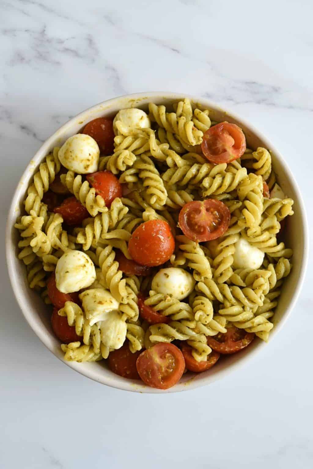 Easy Caprese Pasta Salad with Pesto - Hint of Healthy